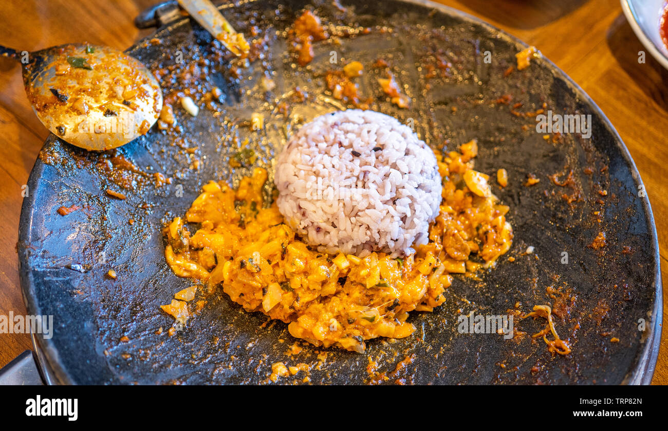 Delicious volcanic shaped fried rice with egg and spicy sauce, pork and ...