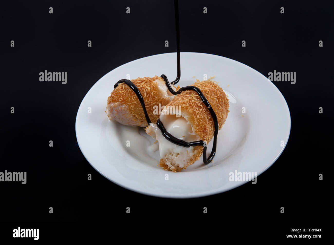 Delicious Turkish dessert. Fried ice-cream covered with chocolate ...