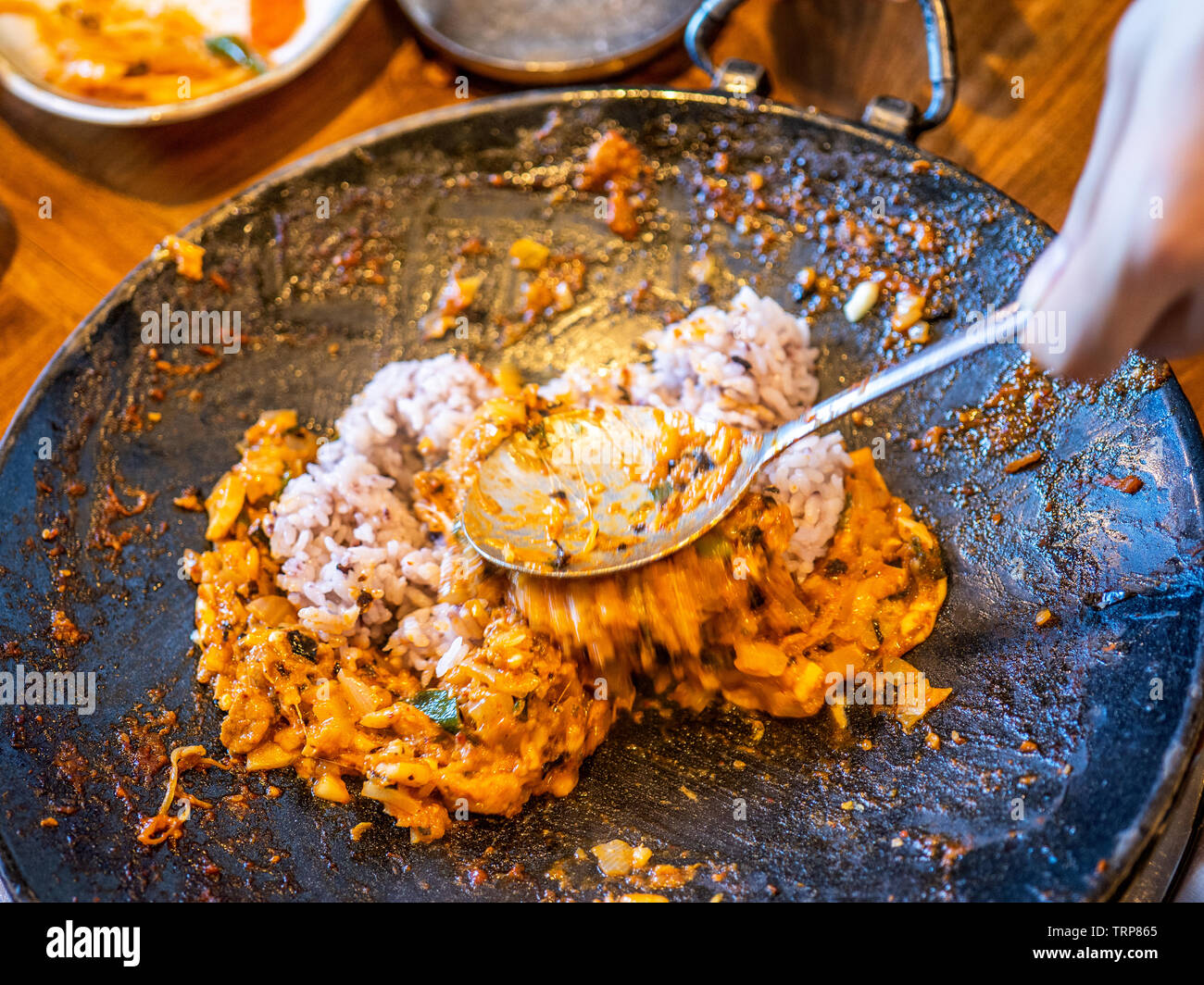 Delicious volcanic shaped fried rice with egg and spicy sauce, pork and ...