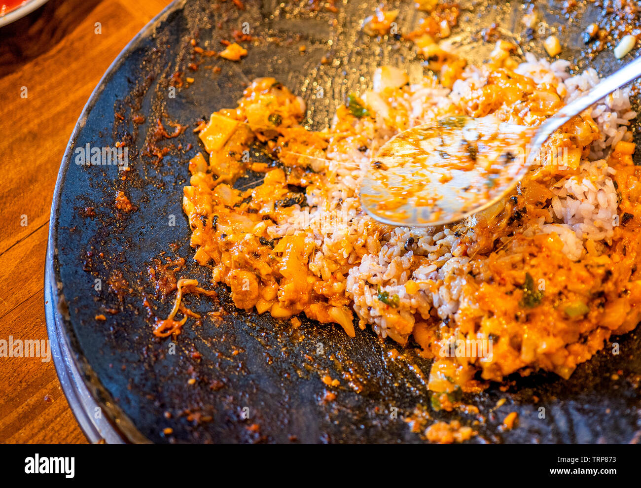 Delicious volcanic shaped fried rice with egg and spicy sauce, pork and ...