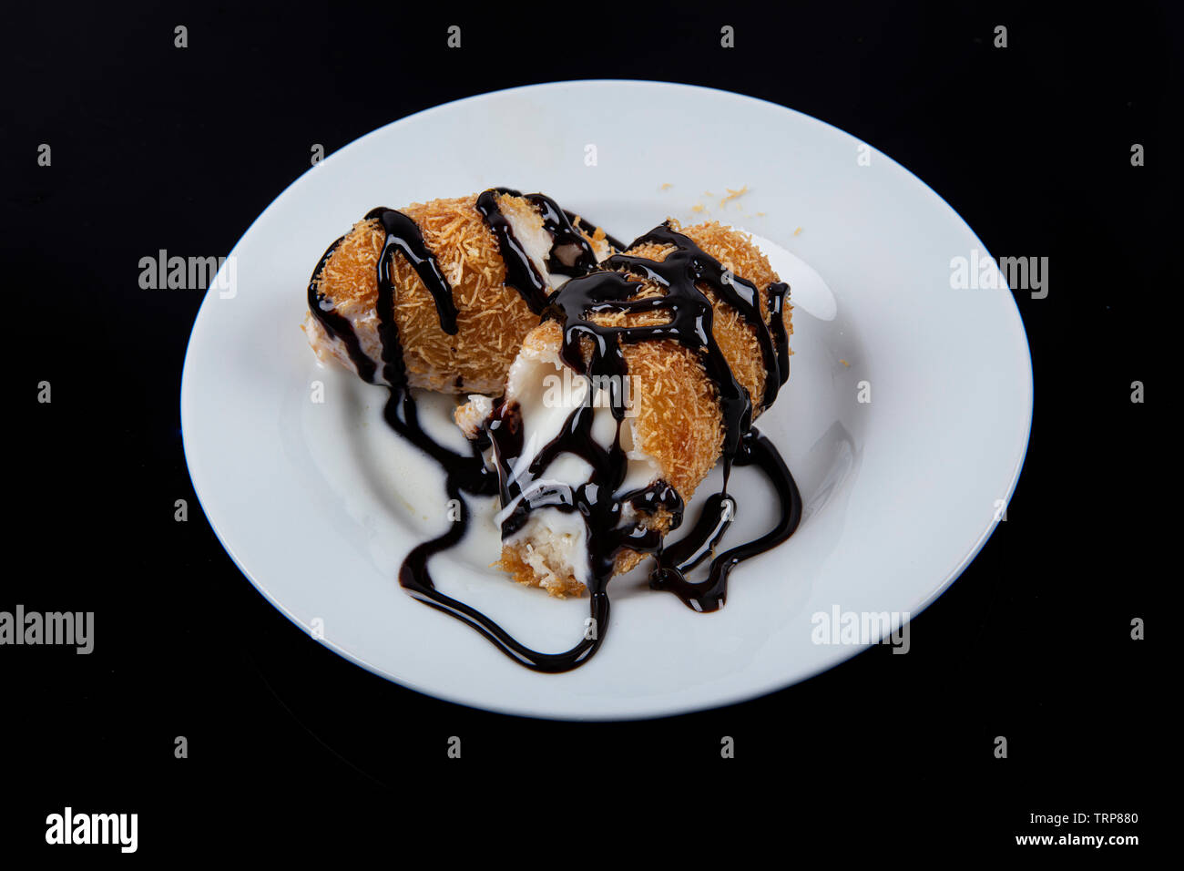 Delicious Turkish dessert. Fried ice-cream covered with chocolate ...