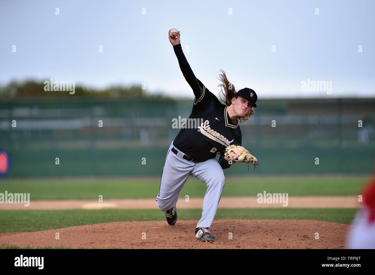 Pitcher releasing a pitch to a waiting hitter. USA Stock Photo - Alamy
