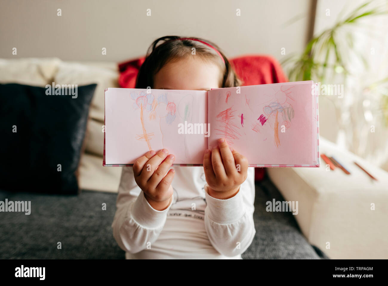 Girl looking at drawings hi-res stock photography and images - Alamy