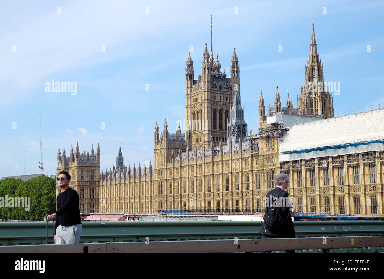 View of Houses of Parliament & pedestrians walking on Westminster ...