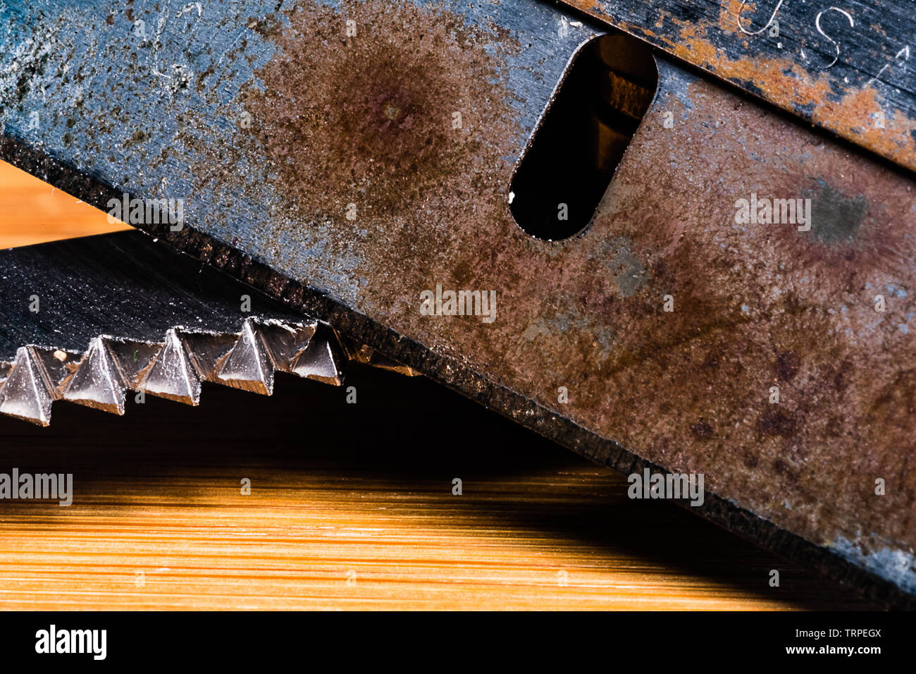 A Macro image of A very old, dull and rusty razor with an equally dirty ...