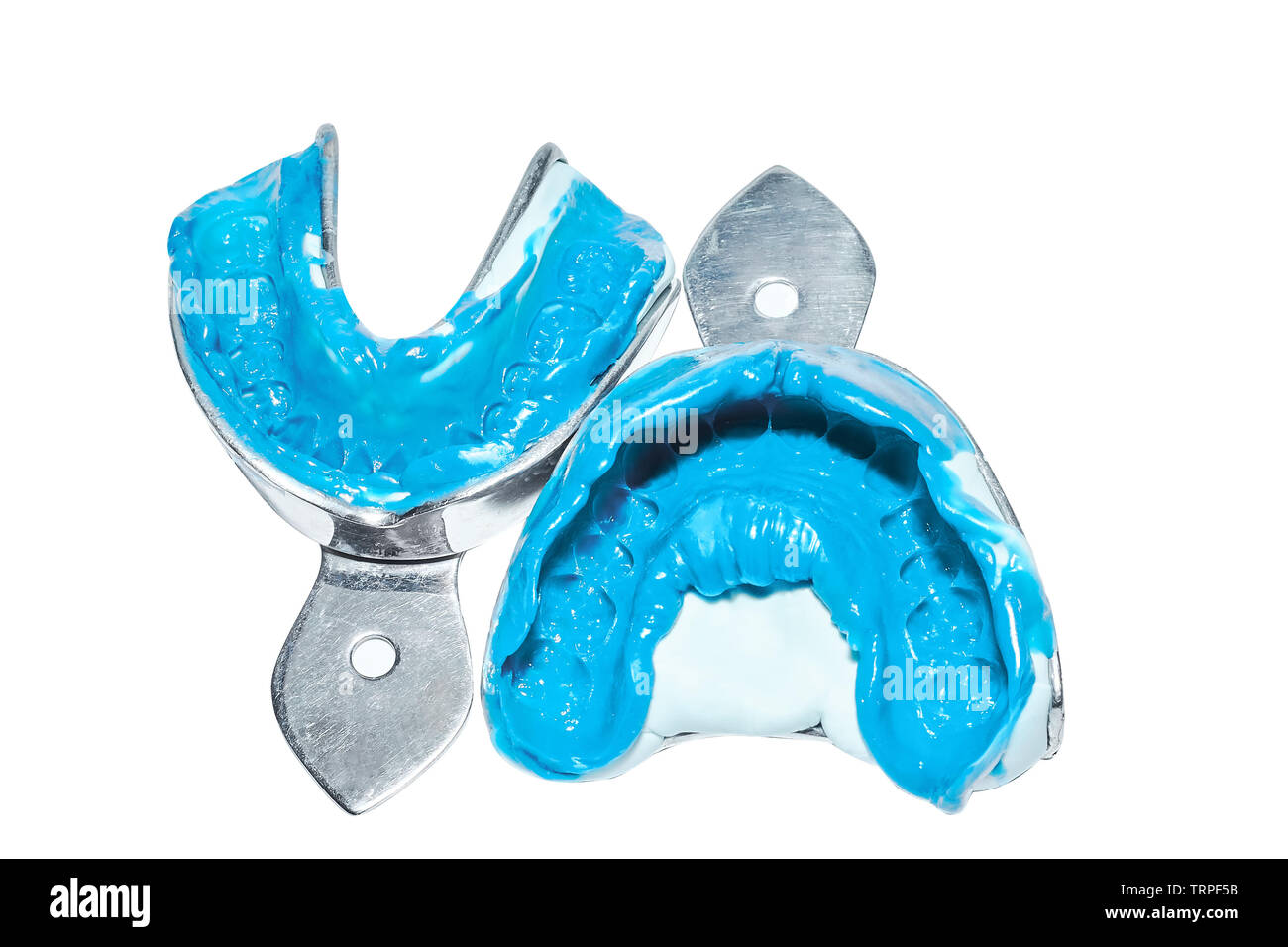 Two dental impressions on a white background. Dental molds from the ...