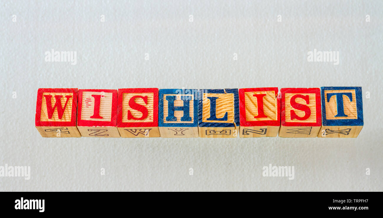 The term wishlist visually displayed using wooden blocks on a clear ...