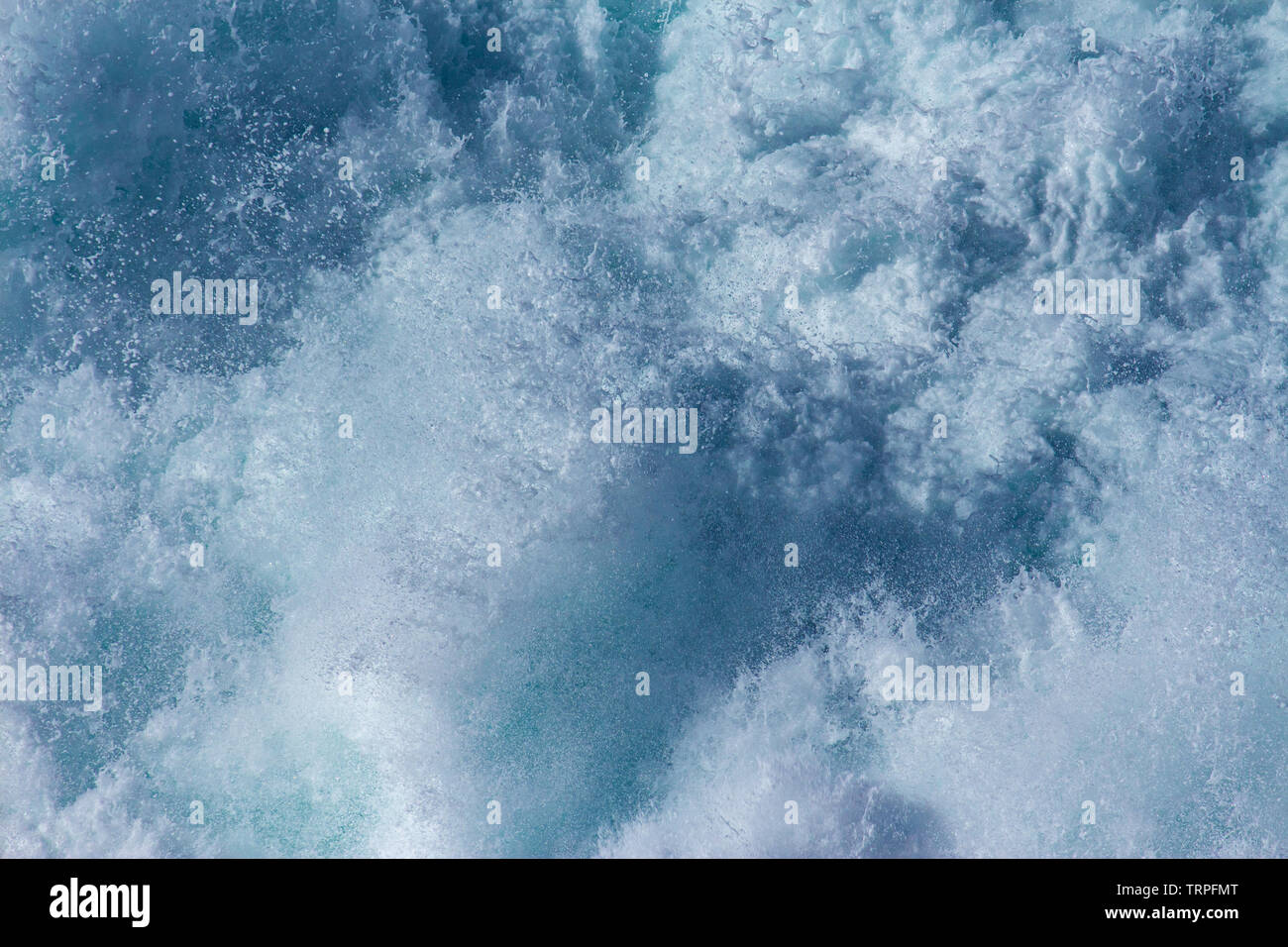 Aquatic background of sea surf waves close up with clear water and ...