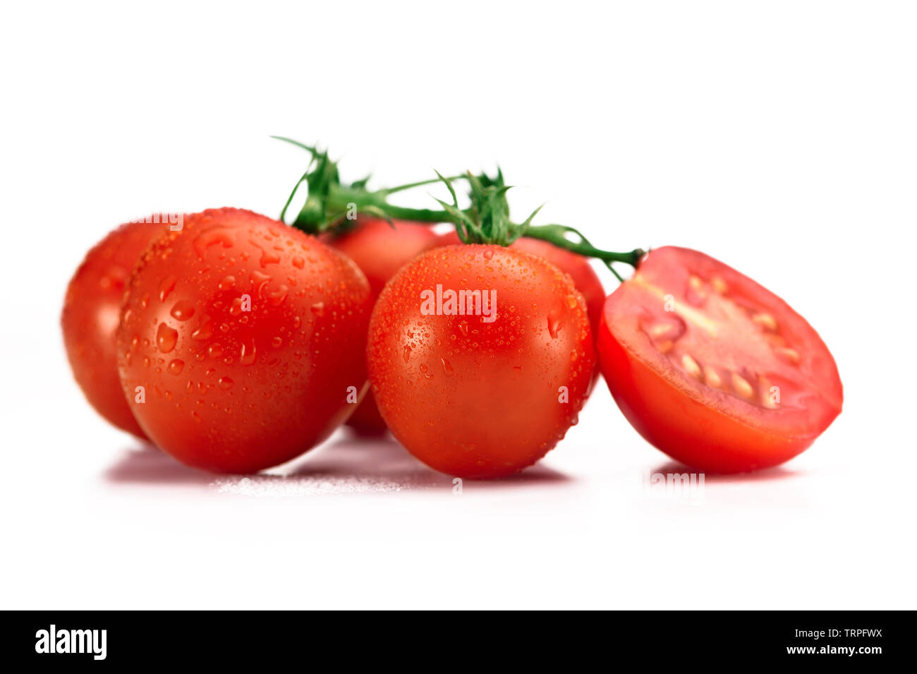 Fresh tomatoes isolated over a white background Stock Photo - Alamy