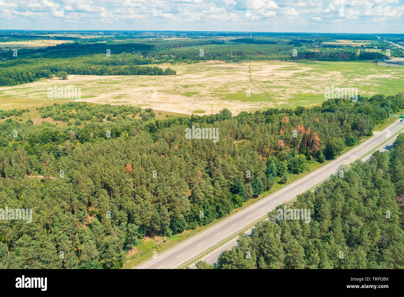 Aerial view of highway, countryside, wood, and fields Stock Photo - Alamy