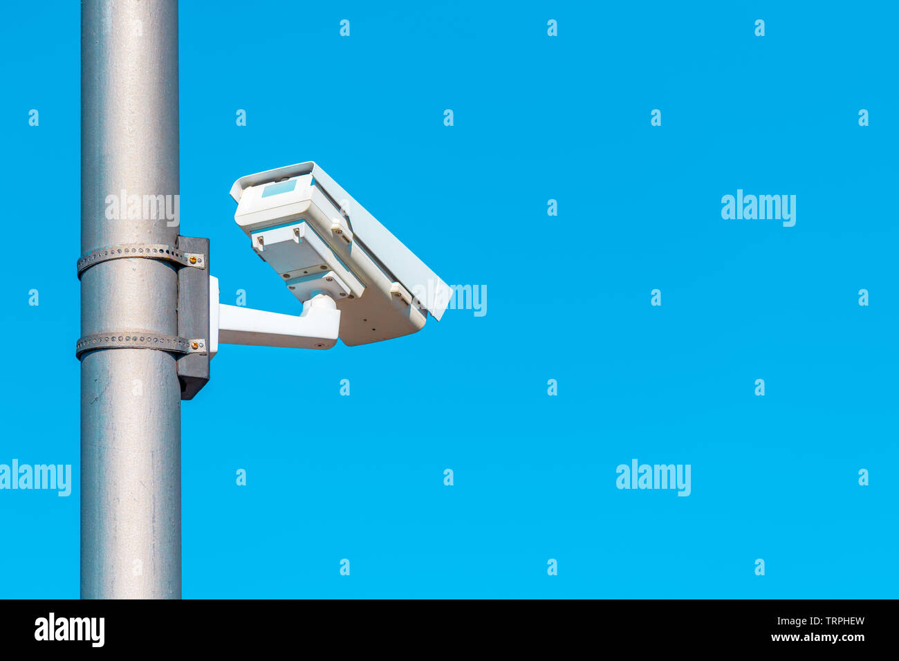 Traffic surveillance camera mounted on the post with large portion of ...