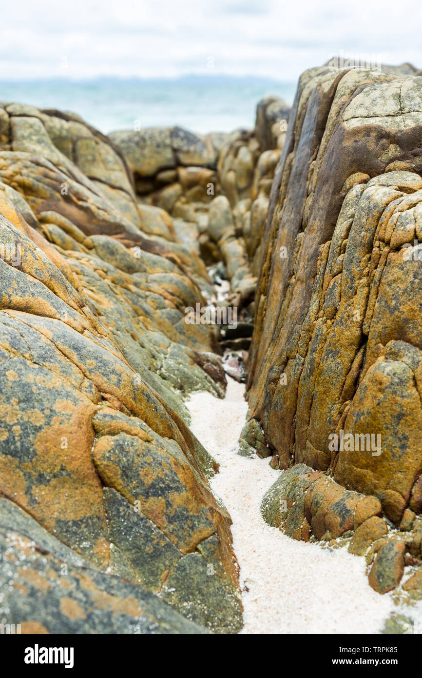 Route stone on sand beach Stock Photo - Alamy