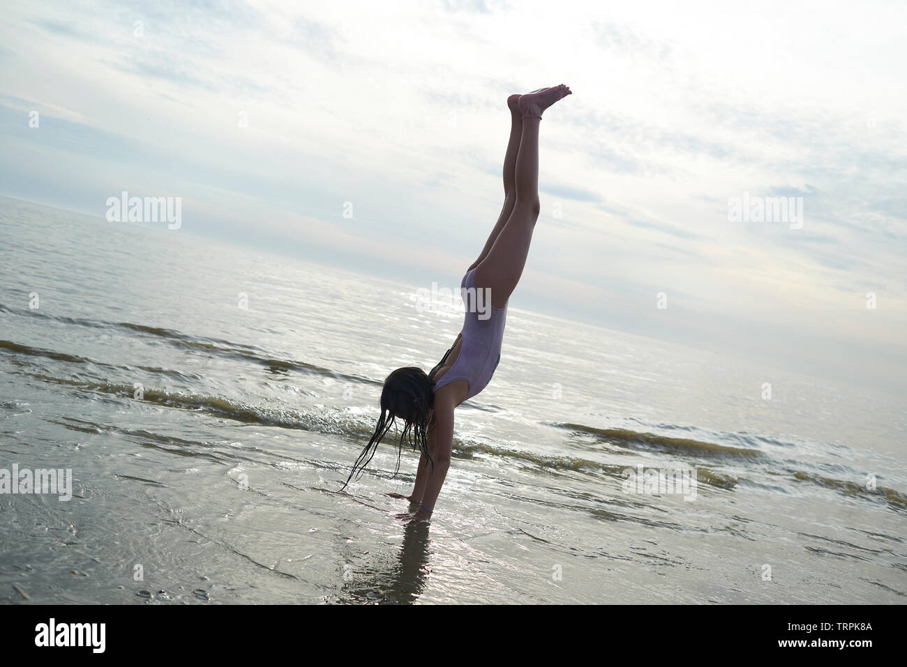 Woman doing handstand in water hi-res stock photography and images - Alamy