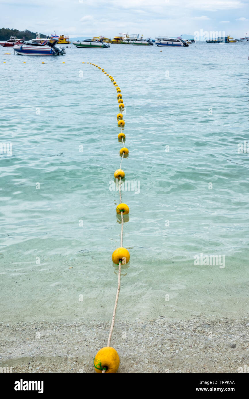 Yellow buoys signs floating on sea Stock Photo - Alamy