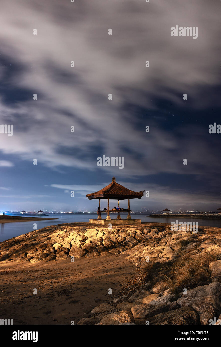 Pavilion on rock jetty with cloudy in sanur beach at Bali Stock Photo ...