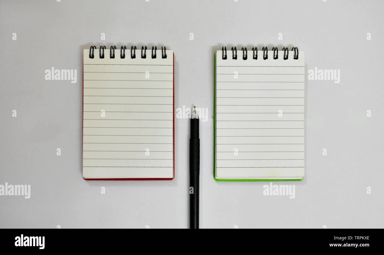 Picture of two notepads with a pen Stock Photo - Alamy