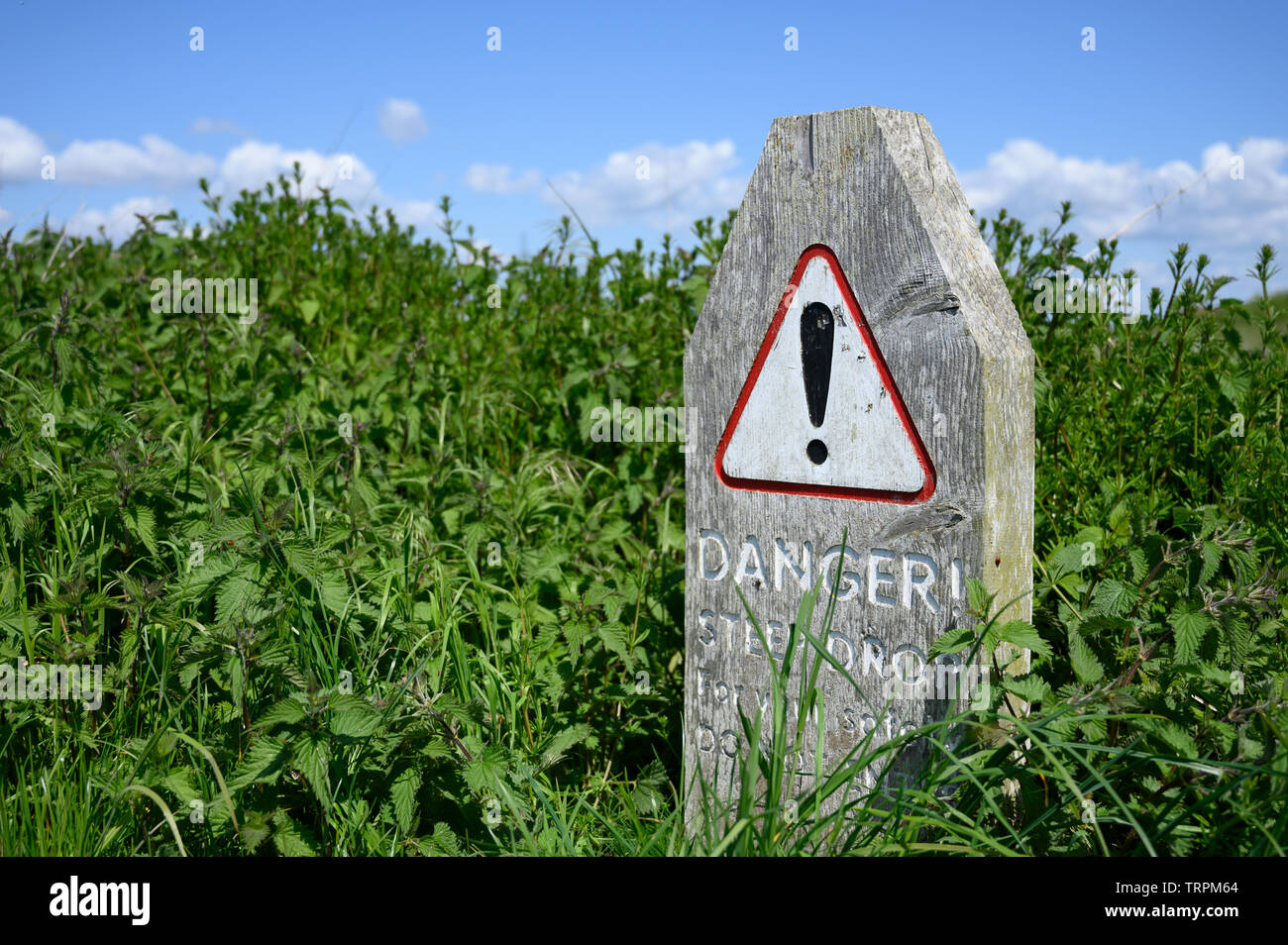 Wooden sign for Danger deep drop Stock Photo - Alamy