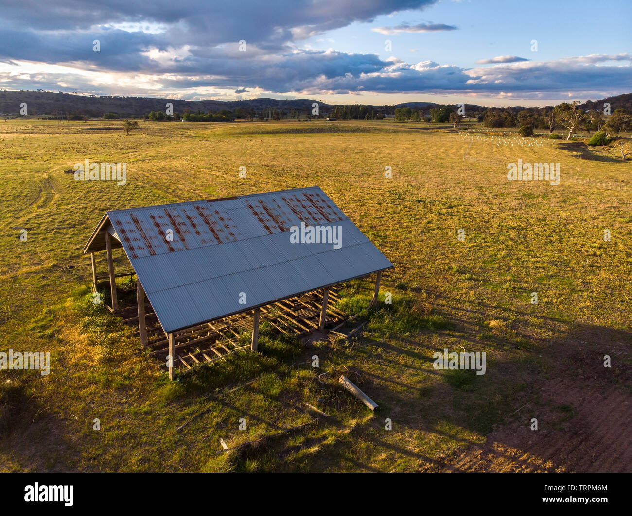 An aerial view of an old shed in the outback farmland of Googong NSW ...