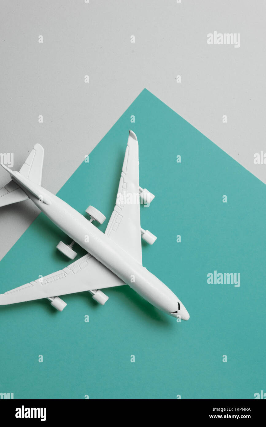 Passenger jet airplane, minimal concept, on blue and white colors paper ...