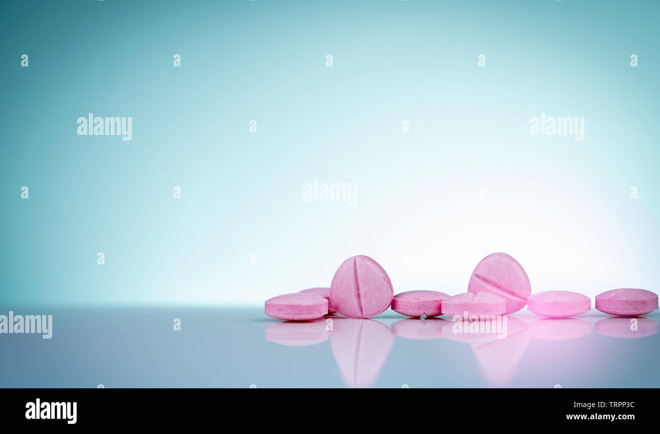 Pink tablets pills with shadow on gradient background. Pharmaceutical ...