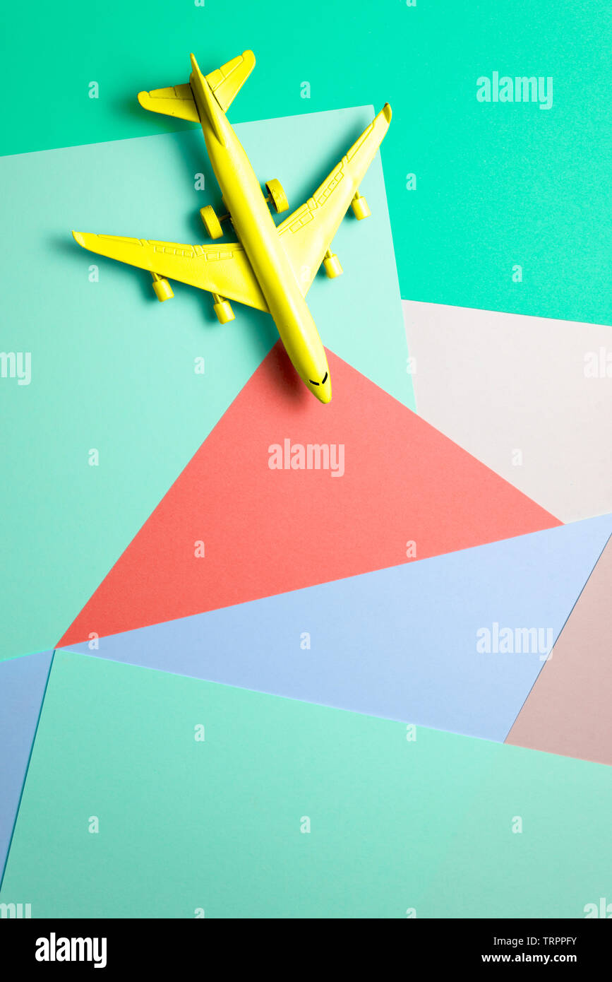 yellow passenger jet airplane, minimal concept, multicolor paper funny ...