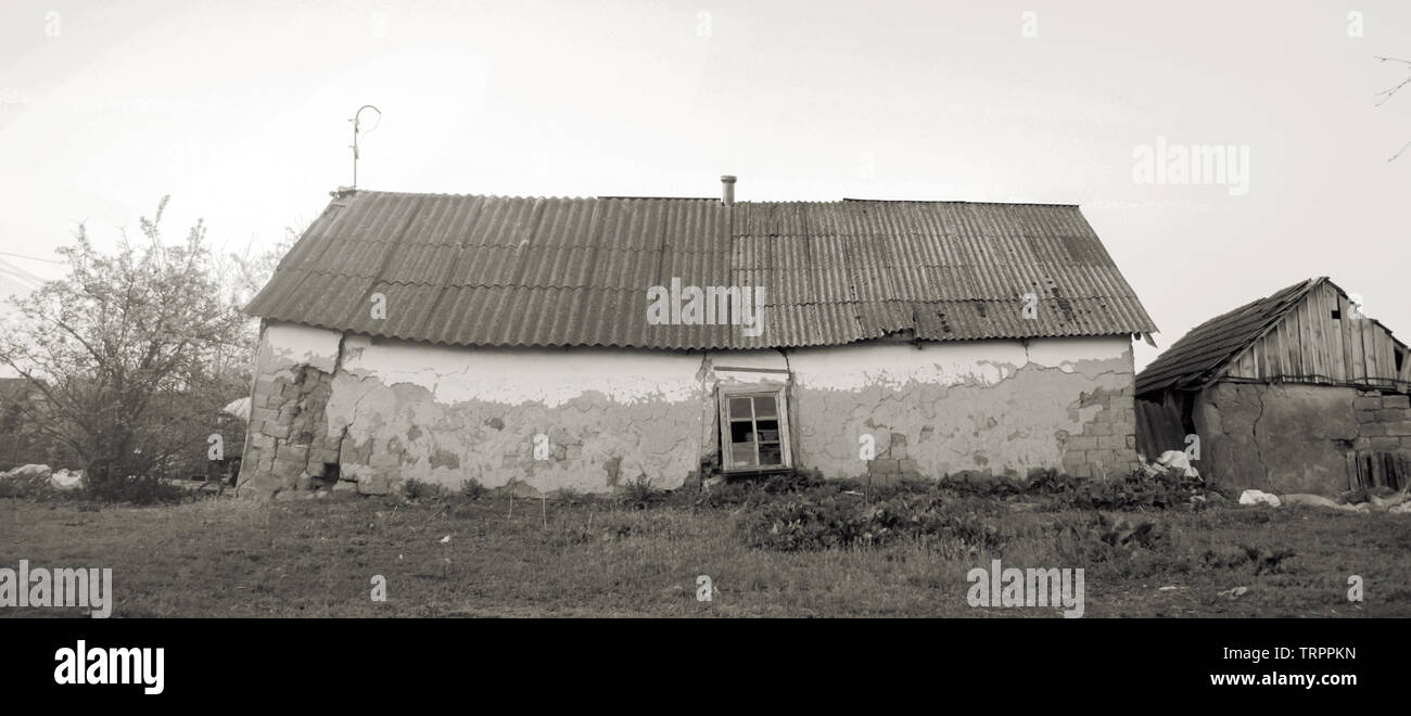 Old ruined house in the countryside. Emergency housing. Disaster. Storm ...