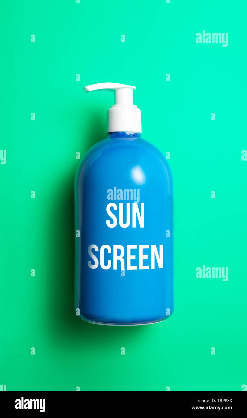 Blue bottle of sunscreen protection cosmetic lotion on turquoise ...