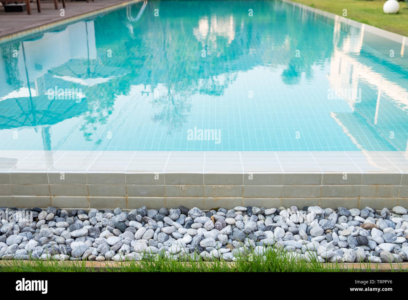 Pool aqua tile stone edge Stock Photo - Alamy