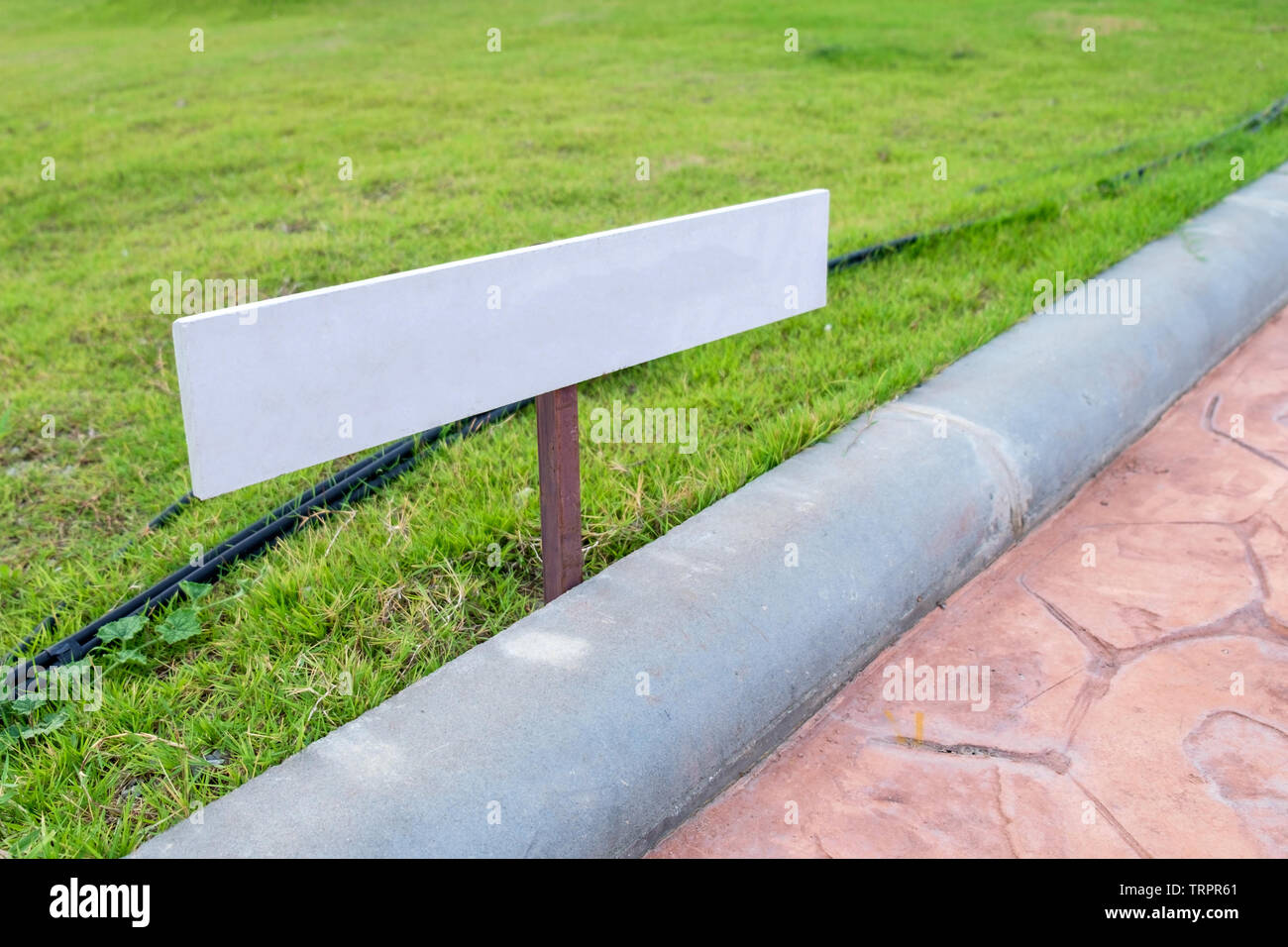 Signs blank side on grass field Stock Photo - Alamy