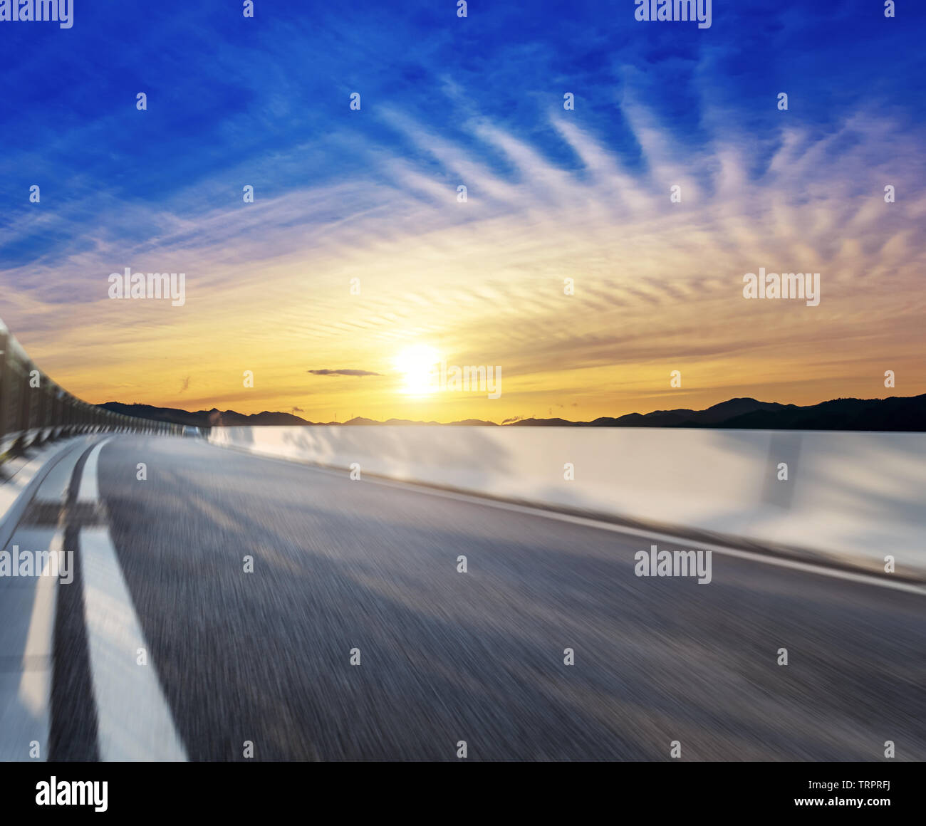 Car-free coastal road at sunrise Stock Photo - Alamy