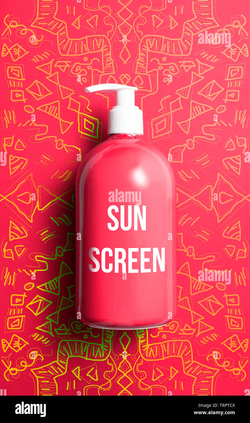 Plastic bottle of sunscreen protection cosmetic lotion on punny pink ...