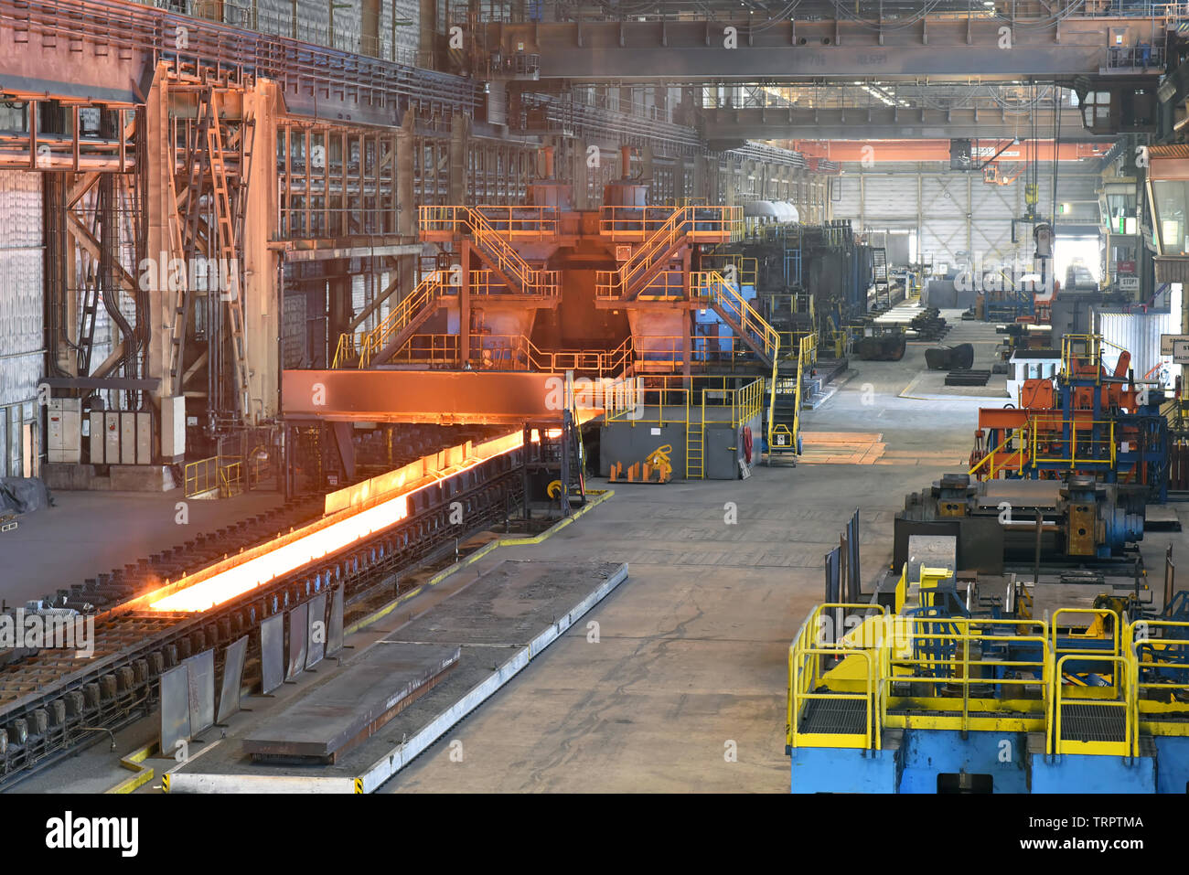 machine with conveyor belt with glowing metal frame in the production ...