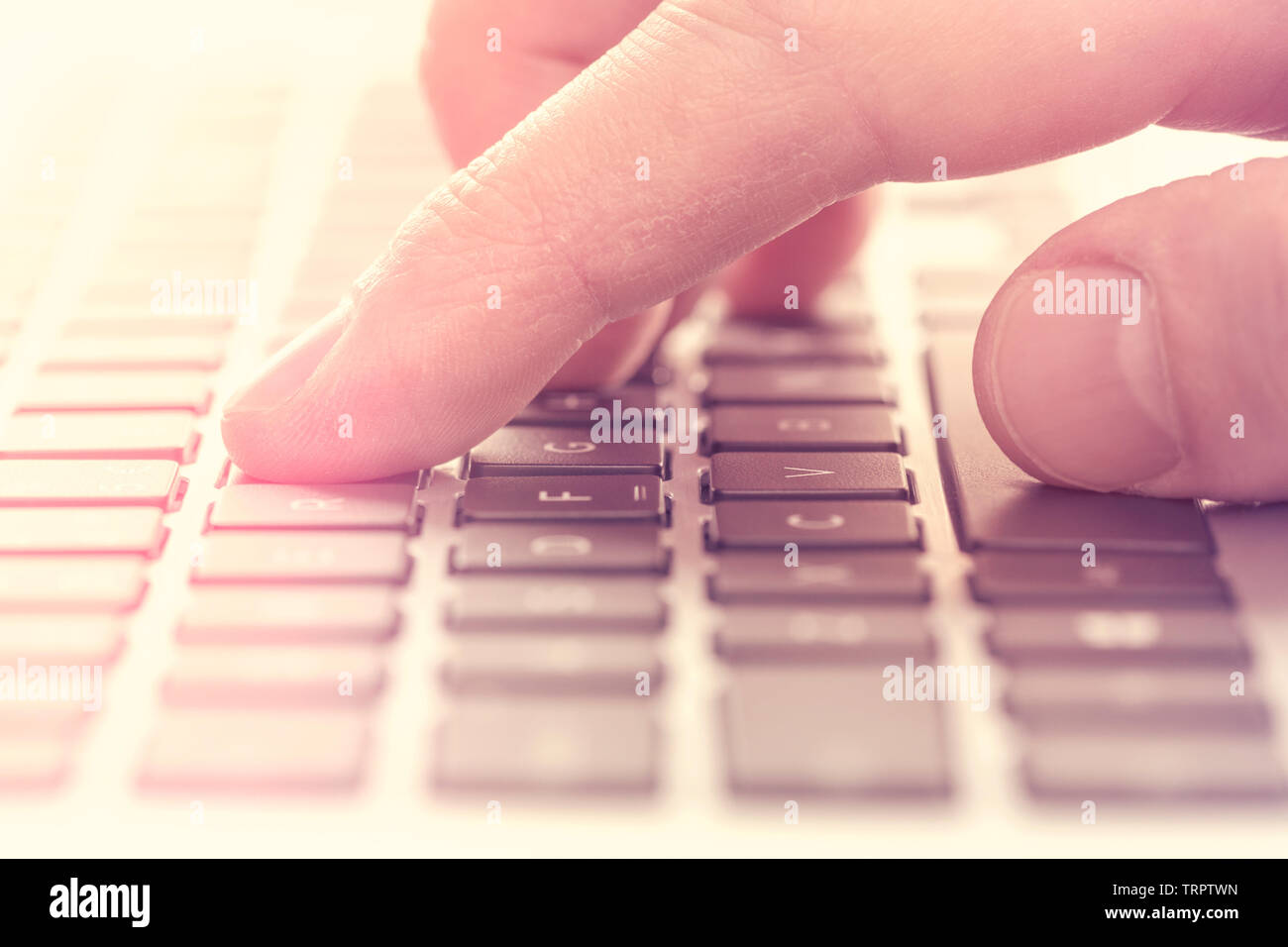 Single finger press button on laptop keyboard. Filtered image Stock ...