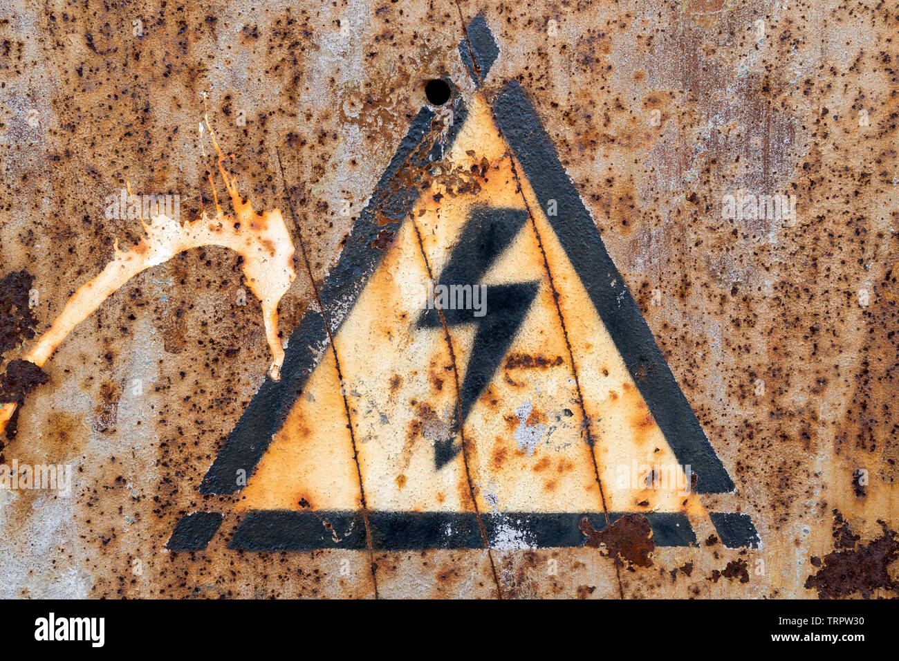 Old, rusty high voltage warning sign Stock Photo - Alamy