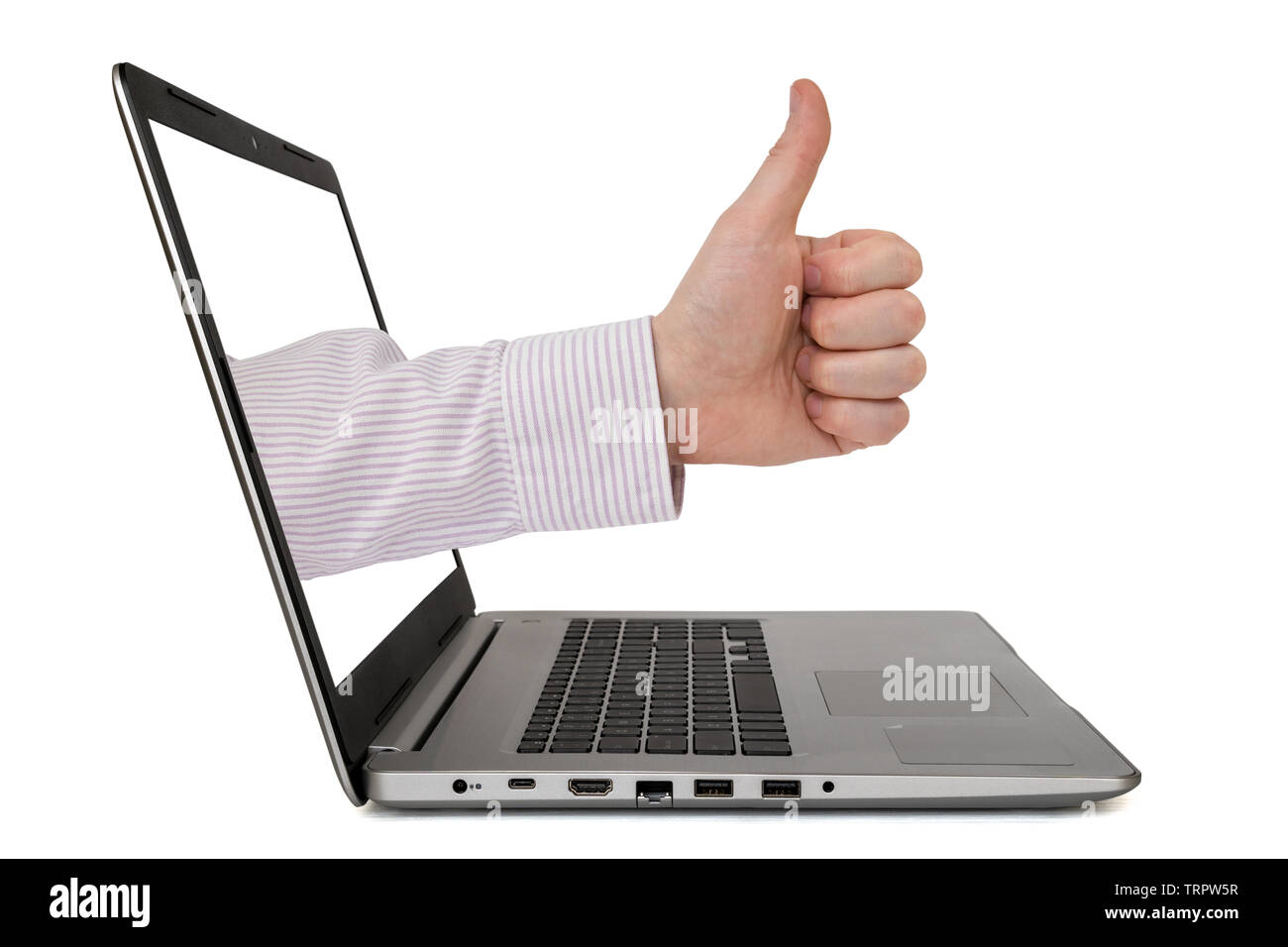Businessman thumbs up through a laptop, isolated on white background ...