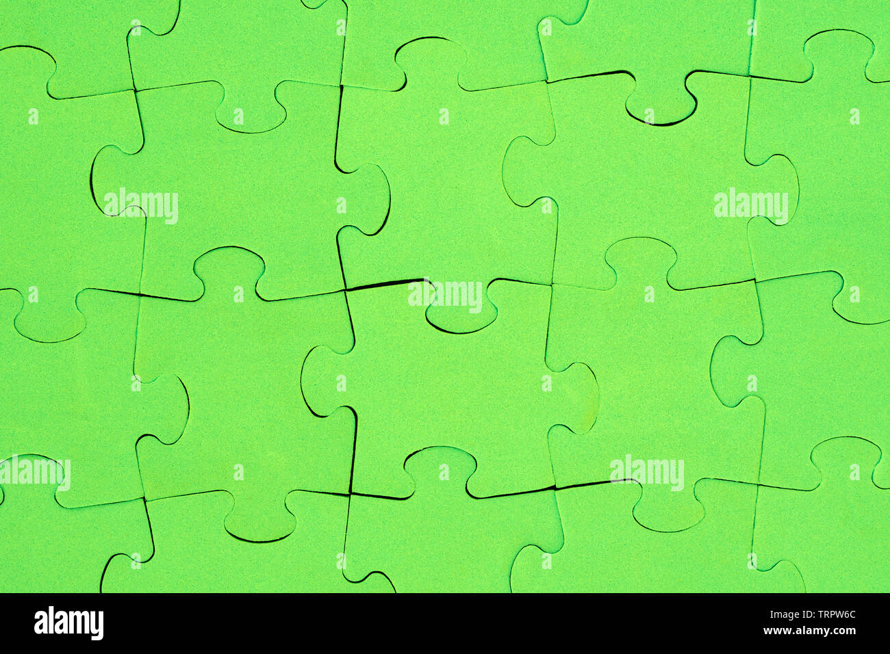 Green Jigsaw puzzle, can be used as background Stock Photo - Alamy
