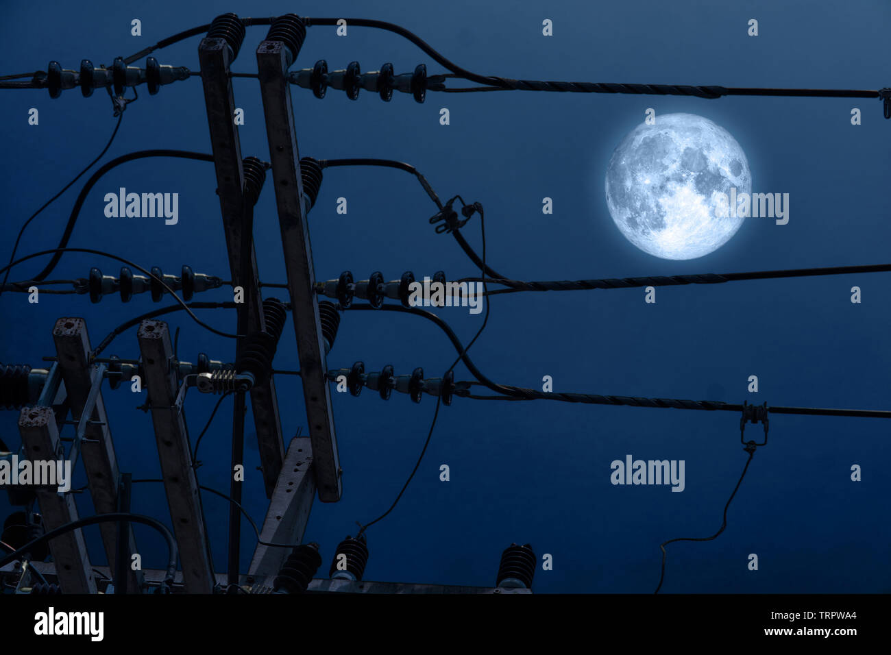 full crust moon back on silhouette power electric line on night sky ...