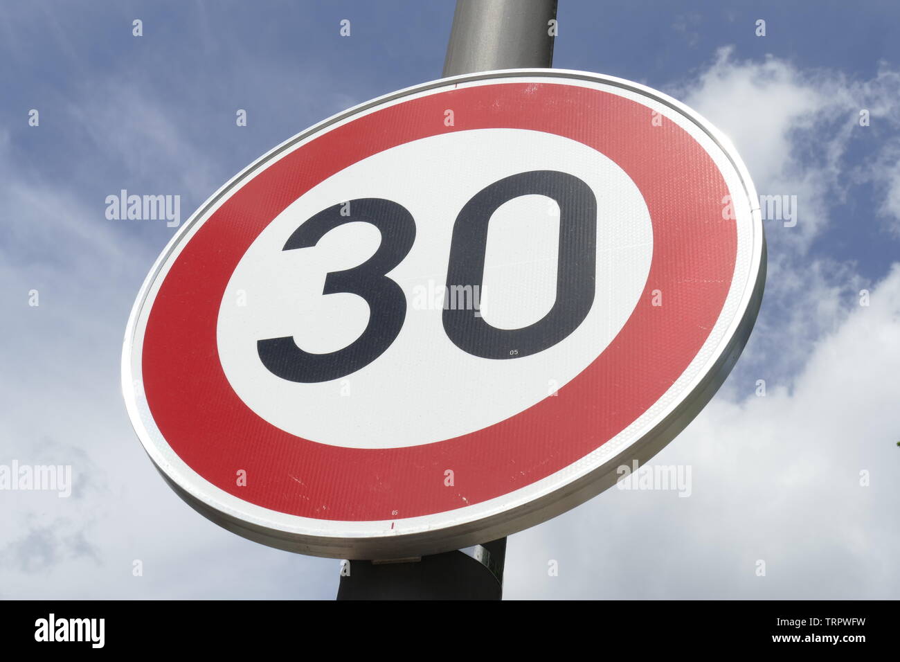 Road sign Maximum Speed 30 km / h, Blue sky with clouds Stock Photo - Alamy