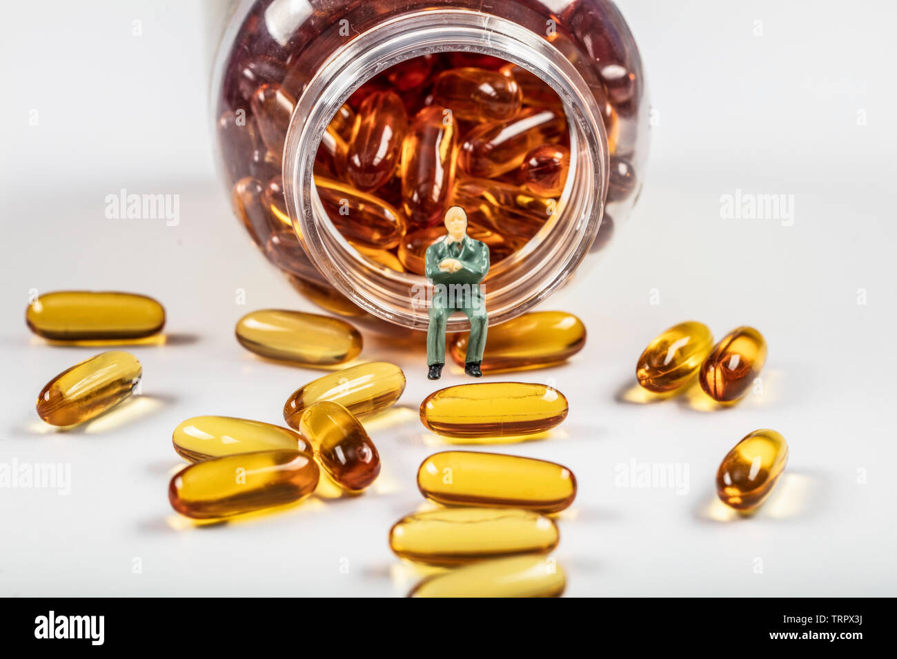 Omega 3 pills spreads on white background. Omega 3 fish oil pills with ... Omega 3 pills spreads on white background. Omega 3 fish oil pills with ...
