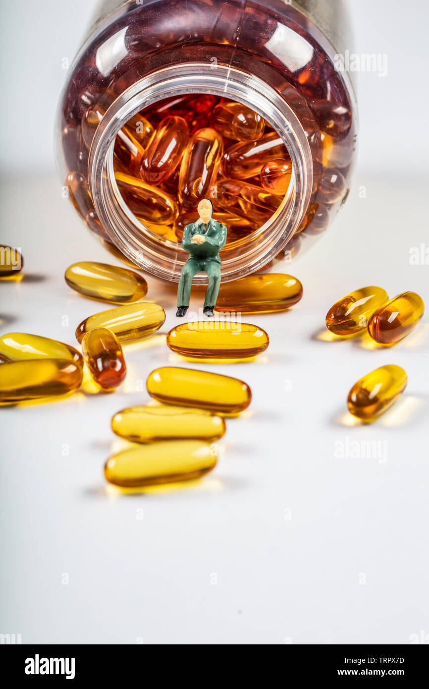 Omega 3 pills spreads on white background. Omega 3 fish oil pills with ... Omega 3 pills spreads on white background. Omega 3 fish oil pills with ...