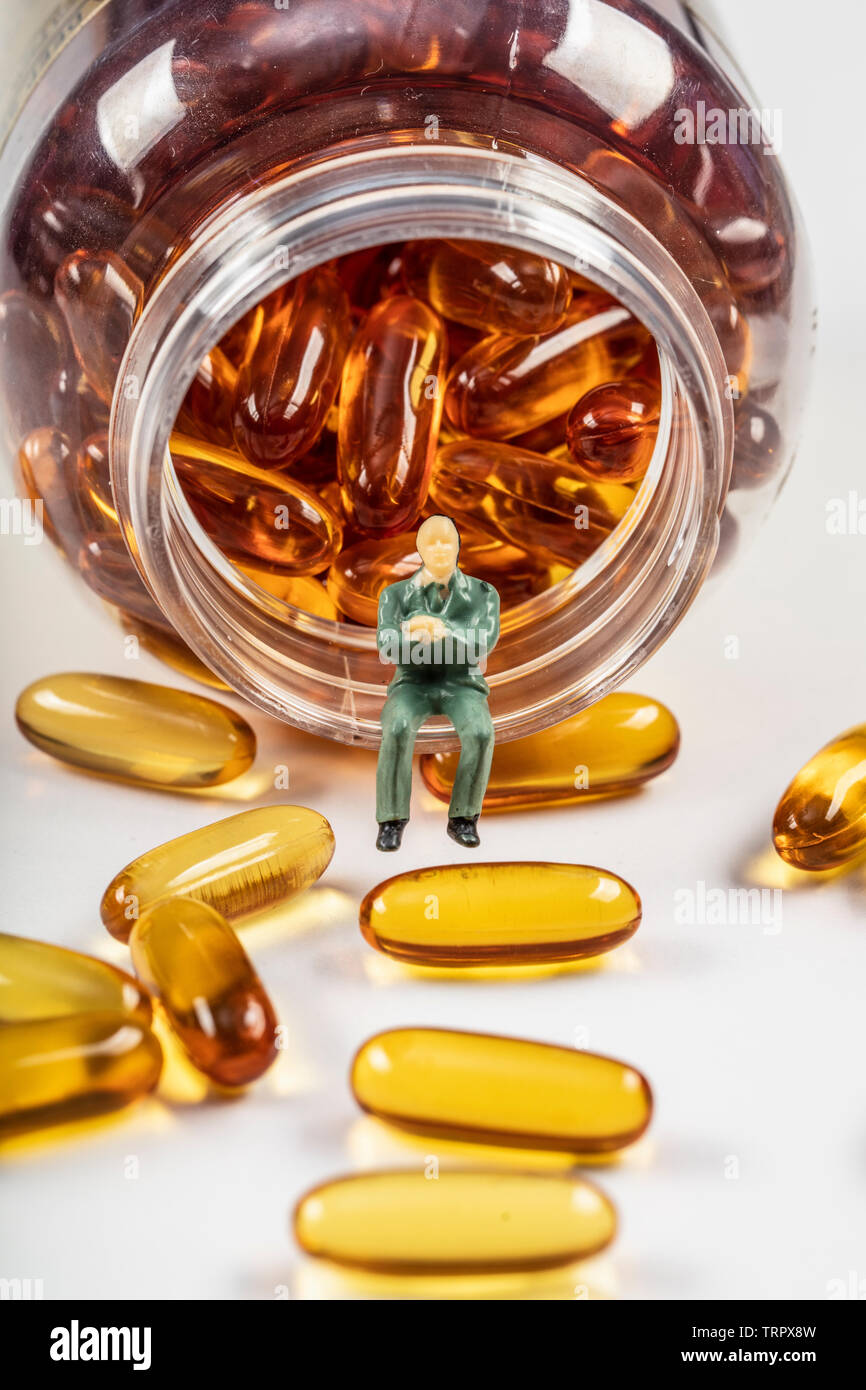 Omega 3 pills spreads on white background. Omega 3 fish oil pills with ... Omega 3 pills spreads on white background. Omega 3 fish oil pills with ...