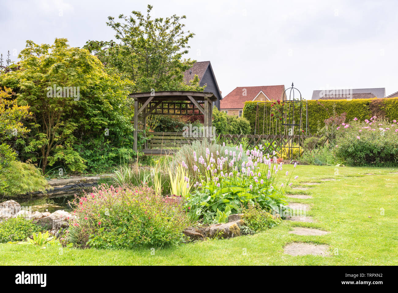 An English back garden in May Stock Photo - Alamy