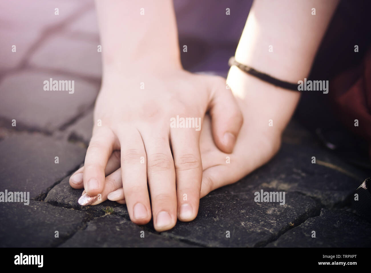 Hand touching stone paving hi-res stock photography and images - Alamy