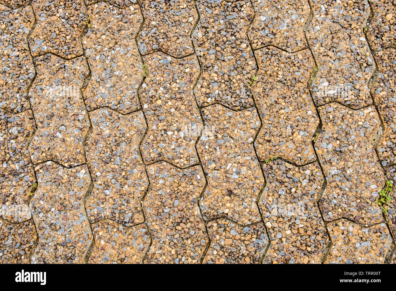 Footpath rough stone texture background Stock Photo - Alamy