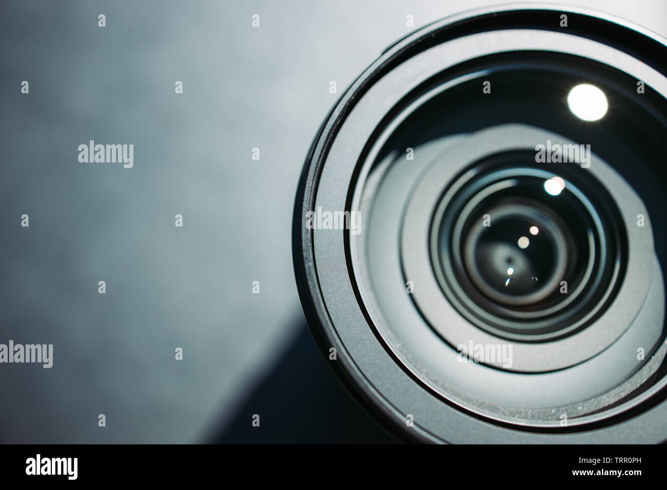 Modern camera lens on dark black background top view Stock Photo - Alamy