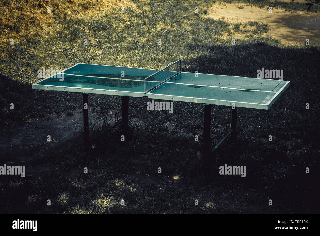 Outdoors abandoned ping pong table, toned image Stock Photo - Alamy