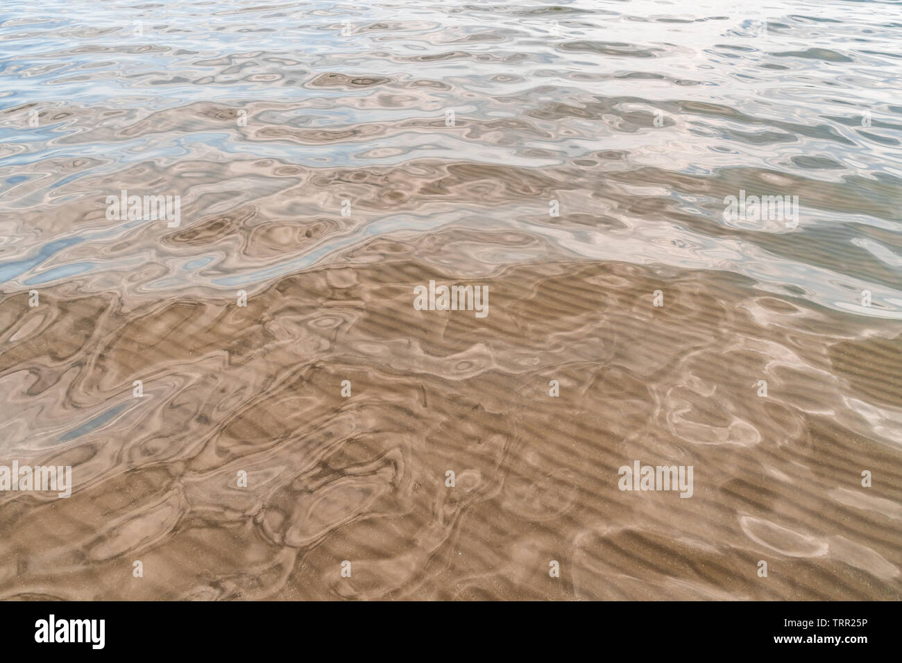 Smooth water surface with sand bottom Stock Photo - Alamy