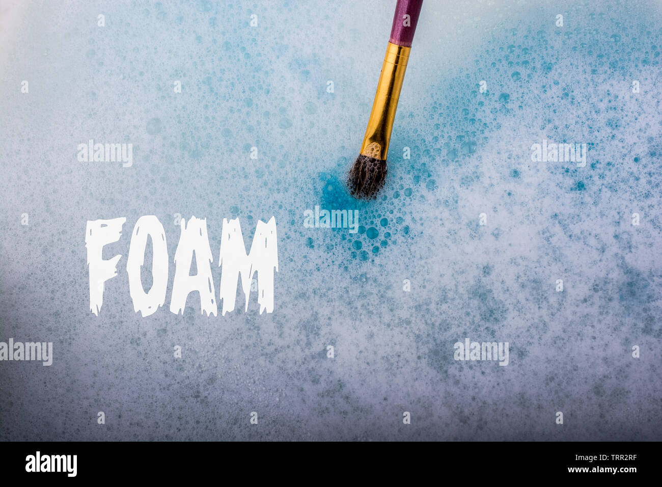 Paint dissolving in water as painting brush touching water Stock Photo ...