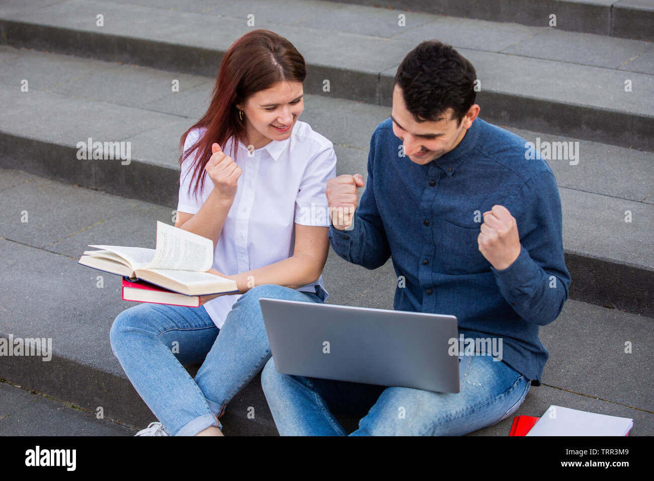 A partnership between two students celebrating success. Happy Students ...