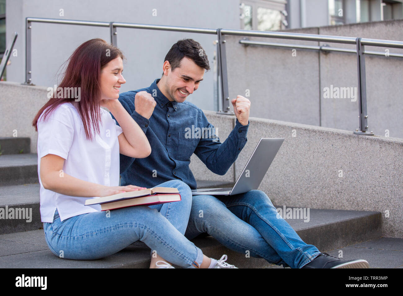 A partnership between two students celebrating success. Happy Students ...